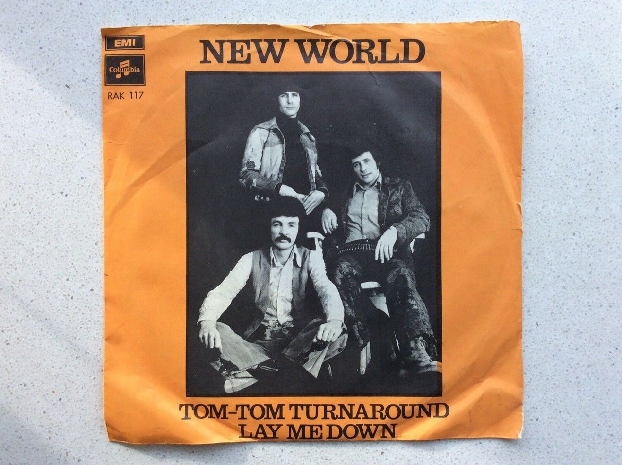 Single, New World, Tom-Tom turnaround-lay me Down. | DBA