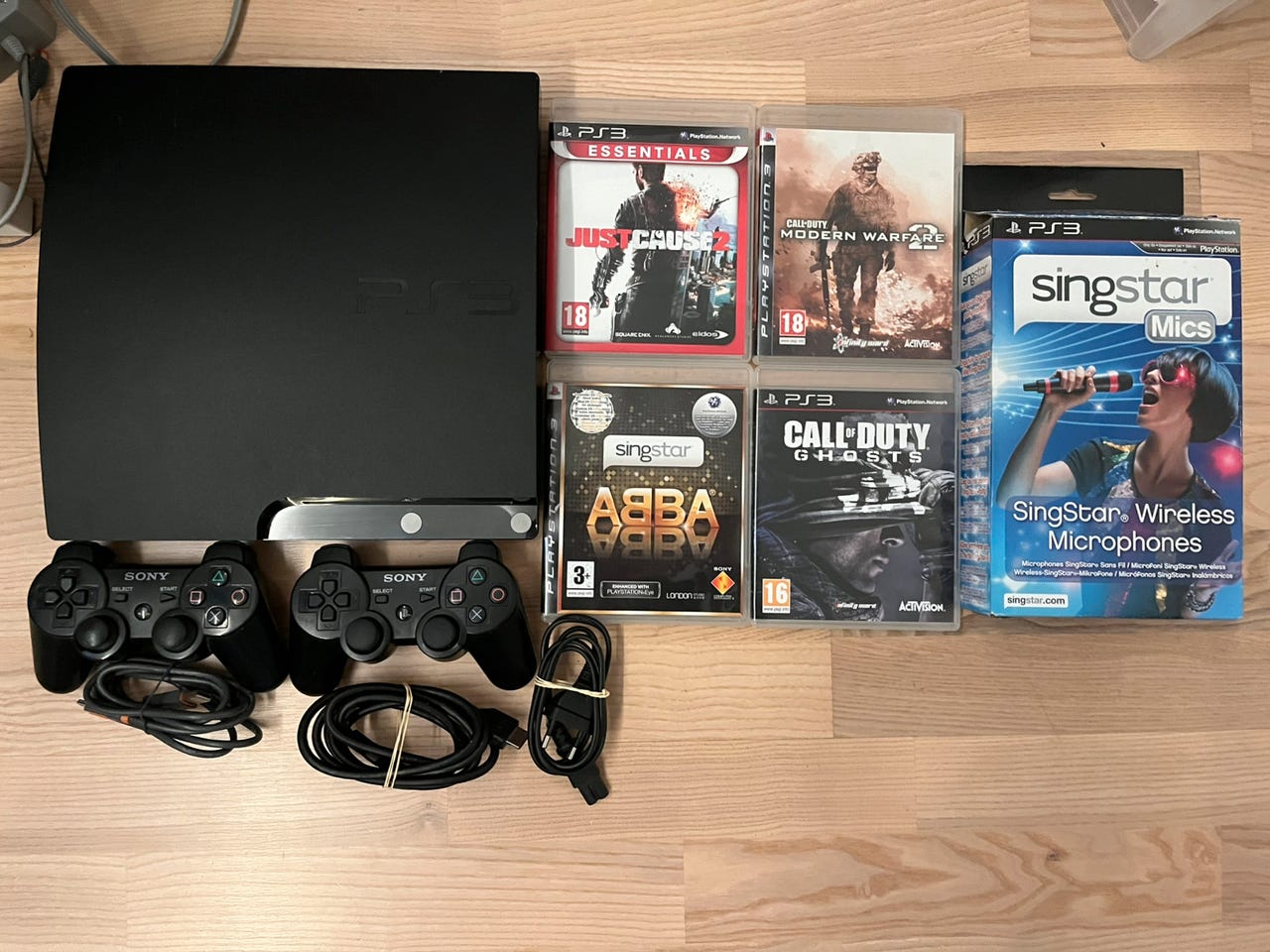 PlayStation 3 Slim med spil & mikrofoner | DBA