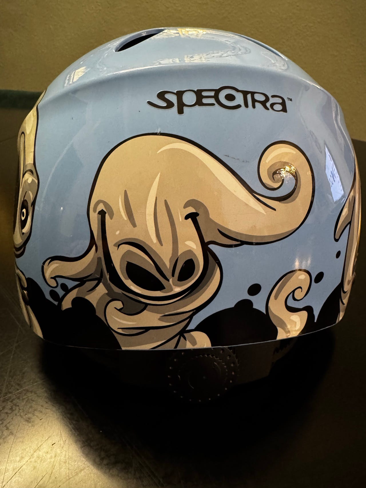 Spectra cykelhjelm med blåt og beige blæksprutte design | DBA